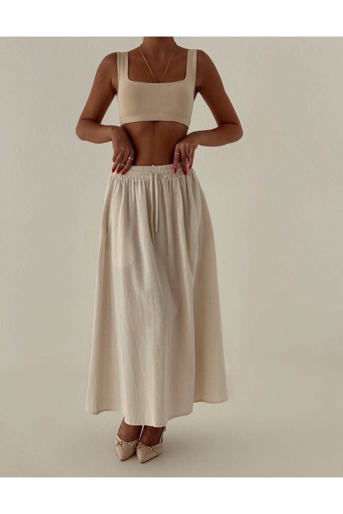 Yüksek Lastikli Bel Keten Yazlık Etek – About US